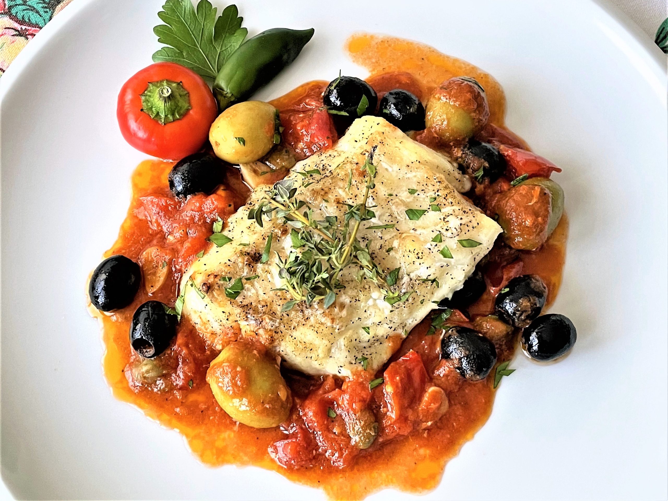 Ricetta di Filetto di merluzzo con olive capperi e pomodoro - alberto ...